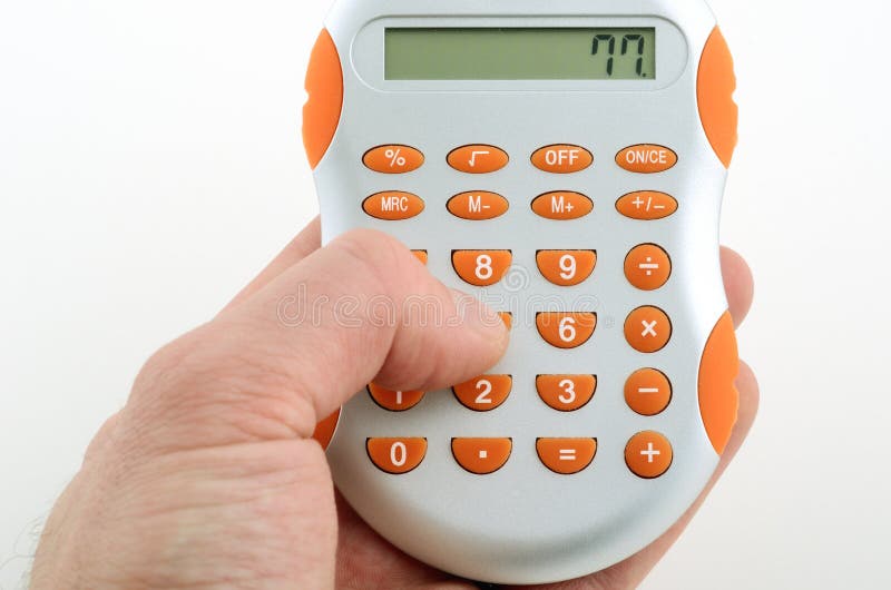 Calculator in hand stock photo. Image of figures, loss - 20049930