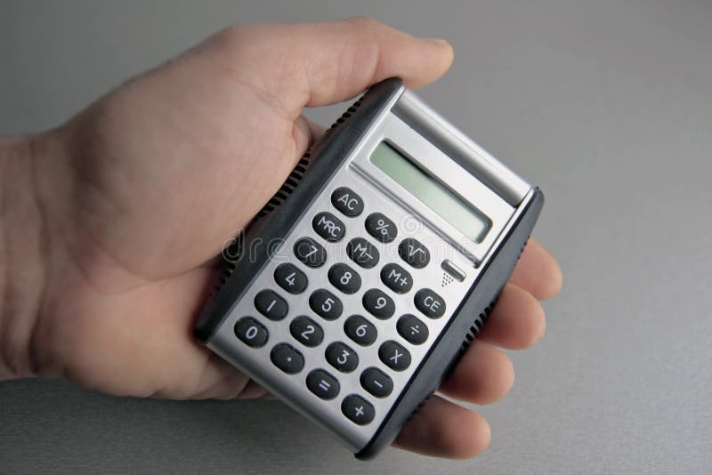 Calculator in hand stock photo. Image of number, profit - 24385034