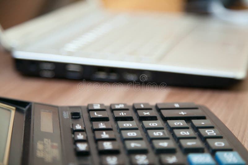 Calculator and Laptop on the Table Stock Photo - Image of game ...