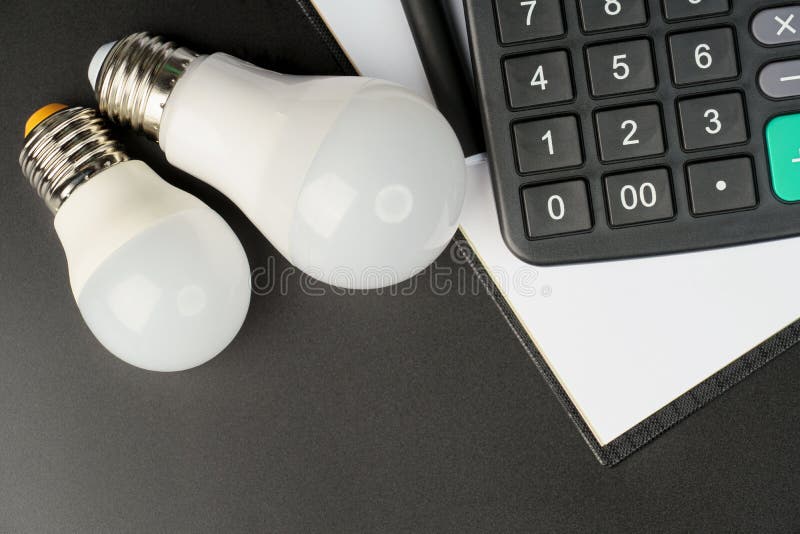 Calculator and LED Lamps on a Black Background. Stock Photo - Image of ...