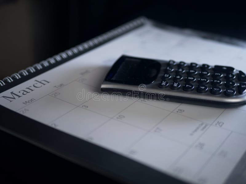 Calculator Left on March Calendar Medium Shot Stock Image - Image of ...