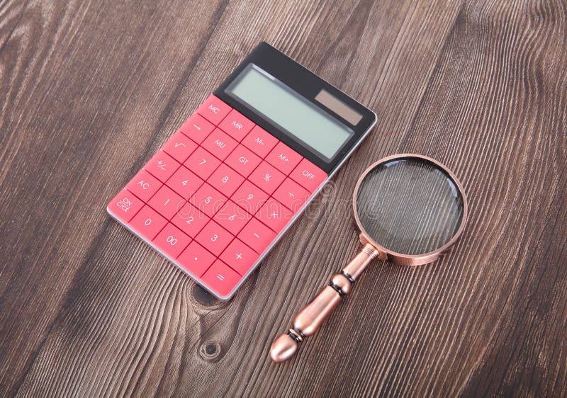 Calculator and Magnifying Glass on the Desk Stock Image - Image of ...