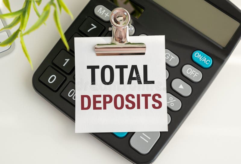A Calculator with a Note on it that Says Total Deposits. Stock Image ...
