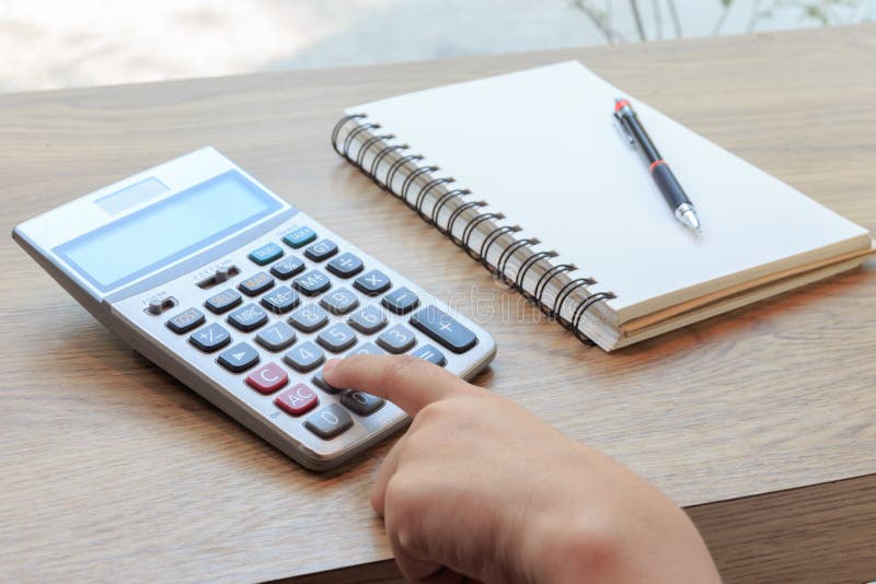 Calculator, Notebook and Pencil on Wood Table Stock Image - Image of ...