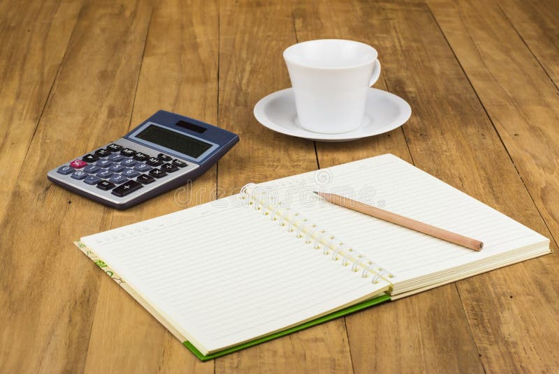 Calculator and Notebook on Wooden Table Stock Image - Image of coffe ...