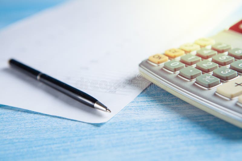 Calculator, Paper and Pen on the Table Stock Image - Image of business ...