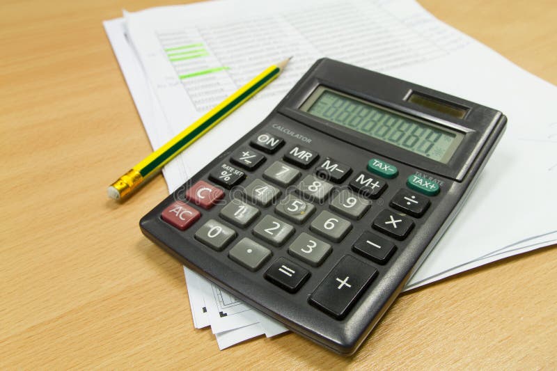Calculator and Paper Sheet on Office Table Stock Photo - Image of ...