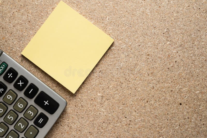 Calculator and Paper Stickers on a Chipboard Table Stock Image - Image ...