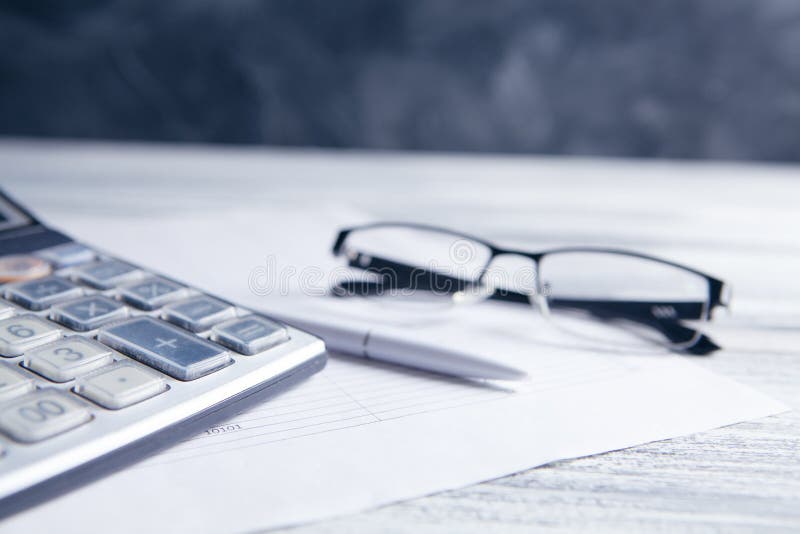 Calculator, Papers, Glasses and Pen on the Table Stock Photo - Image of ...