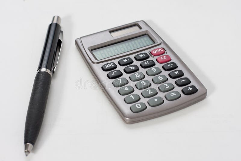 Calculator and a pen stock image. Image of business, paper - 21127515