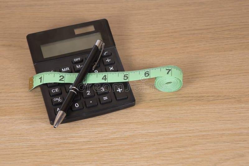 Calculator, Pen with Measuring Tape on Table Stock Image - Image of ...
