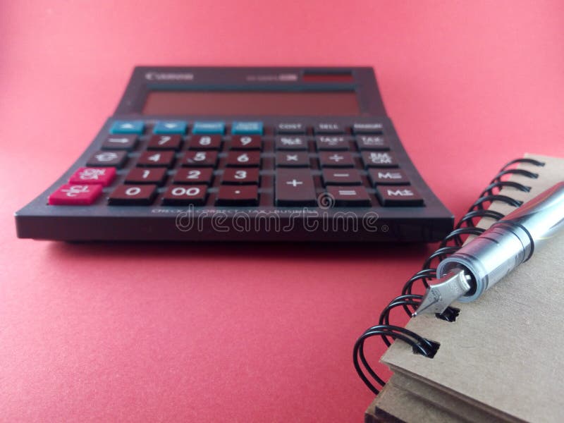 Calculator and Pen on Paper Notepad Stock Image - Image of classic ...