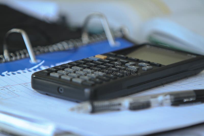Calculator and Pencil on Notebook Stock Image - Image of pencil, binder ...