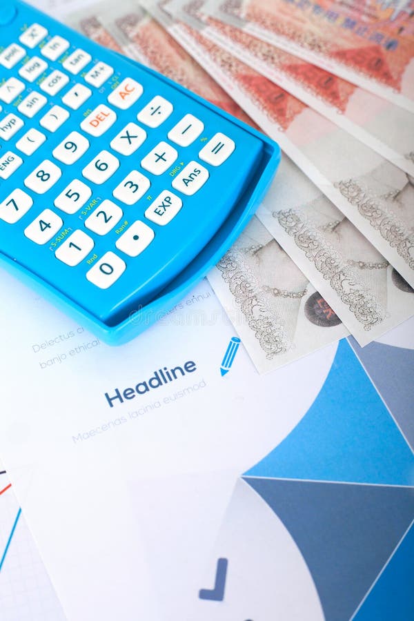 Calculator and Pound Banknotes on Financial Materials Stock Photo ...