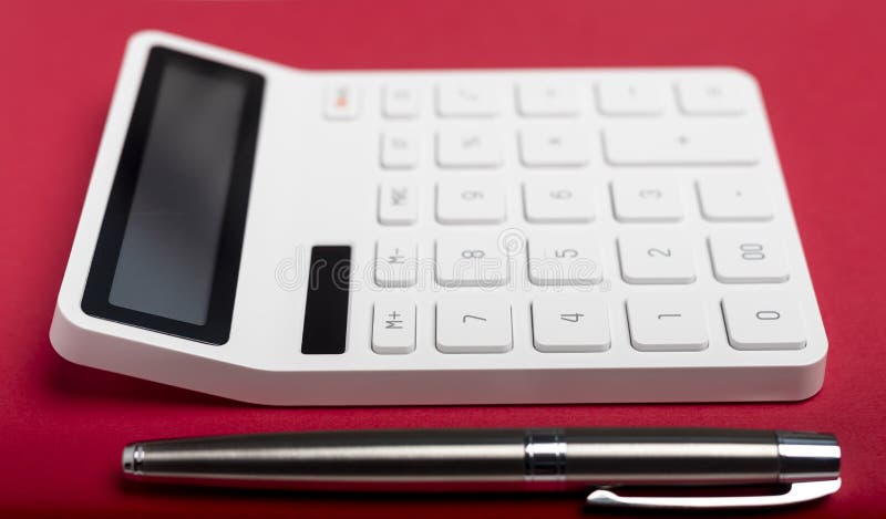 Calculator on Red Table with Pen. Workplace of Accountant, Side View ...