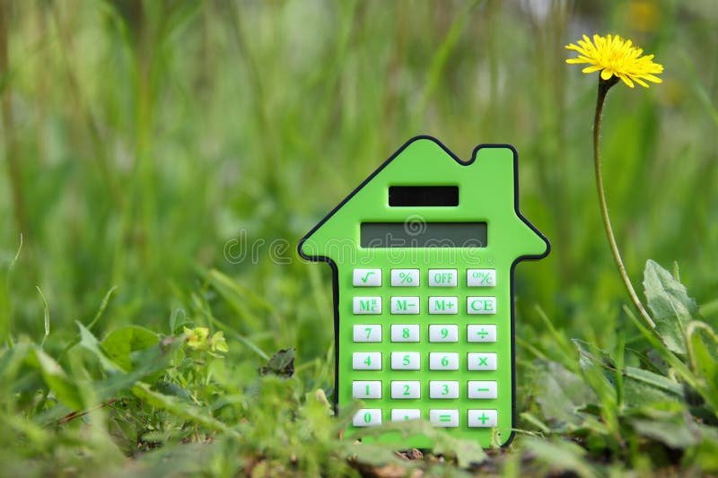Calculator in the Shape of a House in Nature. Idea of Expenses and Real ...