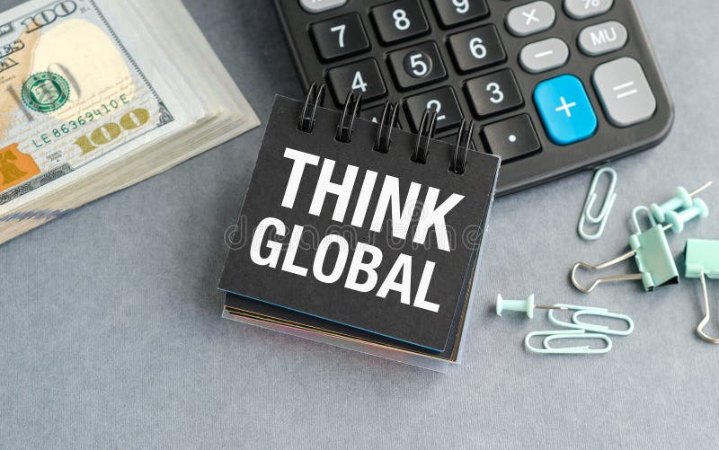 A Calculator Sits on a Desk with a Stack of Money and a Piece of Paper ...