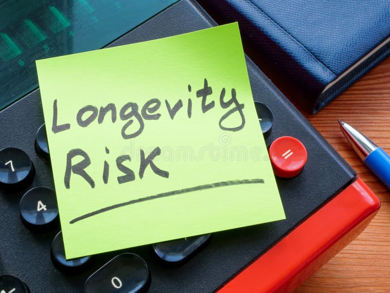A Calculator and Sticker with Words Longevity Risk on it. Stock Image ...