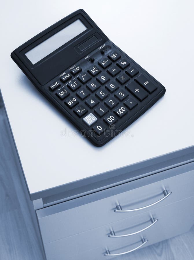 Calculator on a Table at Office Stock Photo - Image of desk, calculator ...