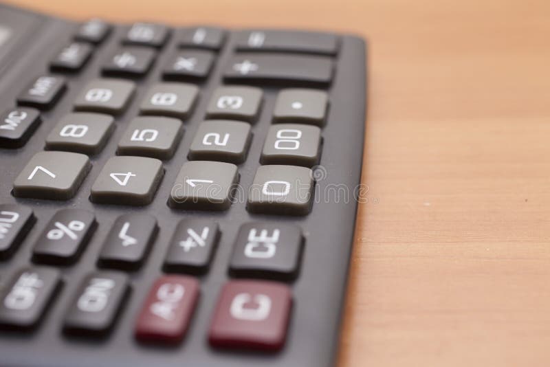 The calculator on a table stock image. Image of economy - 82223855