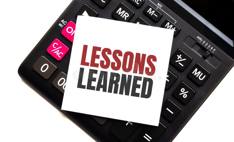 Calculator with Text LESSONS LEARNED with White Paper Stock Image ...