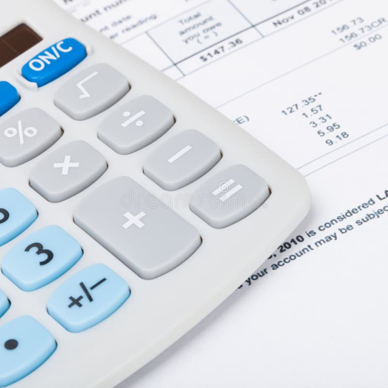 Calculator and Utility Bill Under it - Close Up Shot Stock Image ...