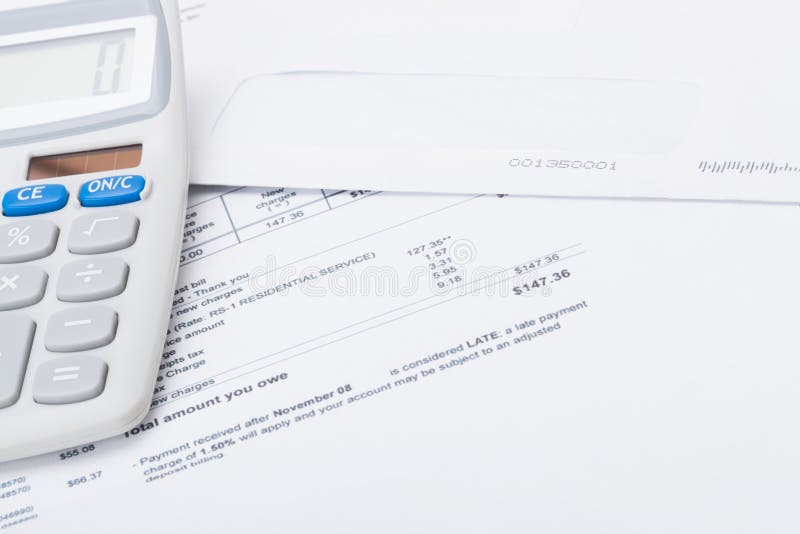 Calculator with Utility Bill Under it Stock Photo - Image of financial ...