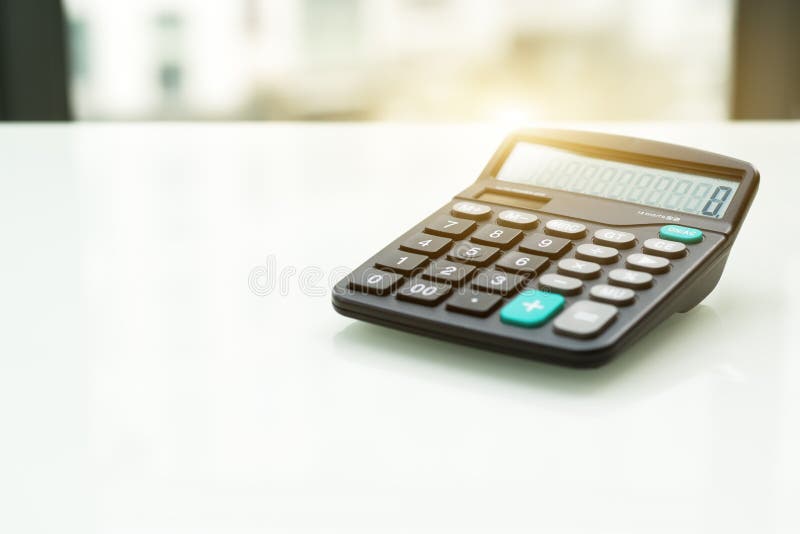 Calculator on the White Table Near Window, Side View with Flare Filter ...