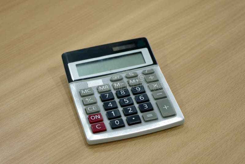 Calculator on wood table stock image. Image of math, finance - 36335389