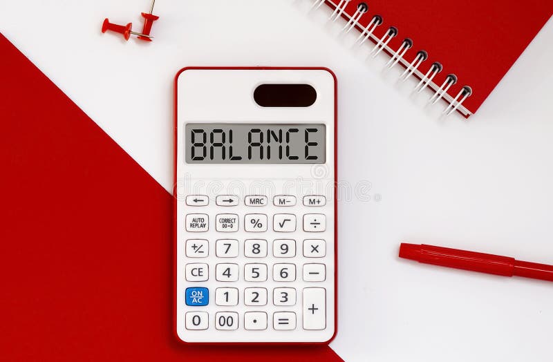 Calculator with the Word BALANCE on the Display with Red Notepad and ...
