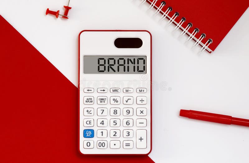 Calculator with the Word BRAND on the Display with Red Notepad and ...