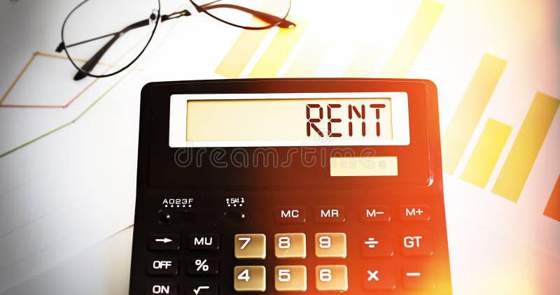 Calculator with the Word RENT on the Display with Chart and Glasses ...