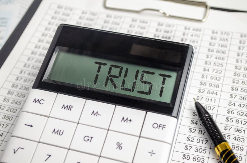 Calculator with the Word TRUST on Display with Chart Stock Image ...