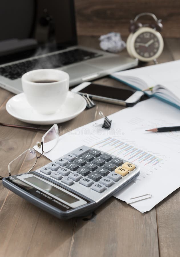 Calculator on Work Table with Computer Notebook Mobile Phone and Stock ...
