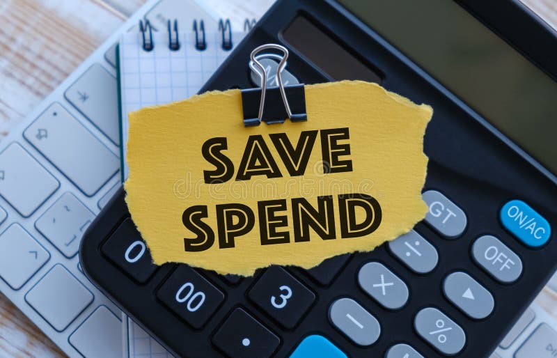 Calculator with Yellow Sticky Note Displaying Save Spend Message ...