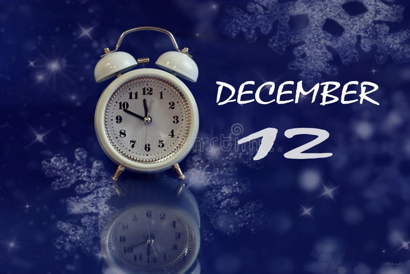 Calendar for December 12: White Alarm Clock on a Blue Background with ...