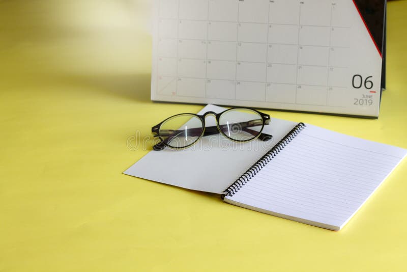 Calendar with a Note Lies on a Wooden Table Stock Image - Image of ...