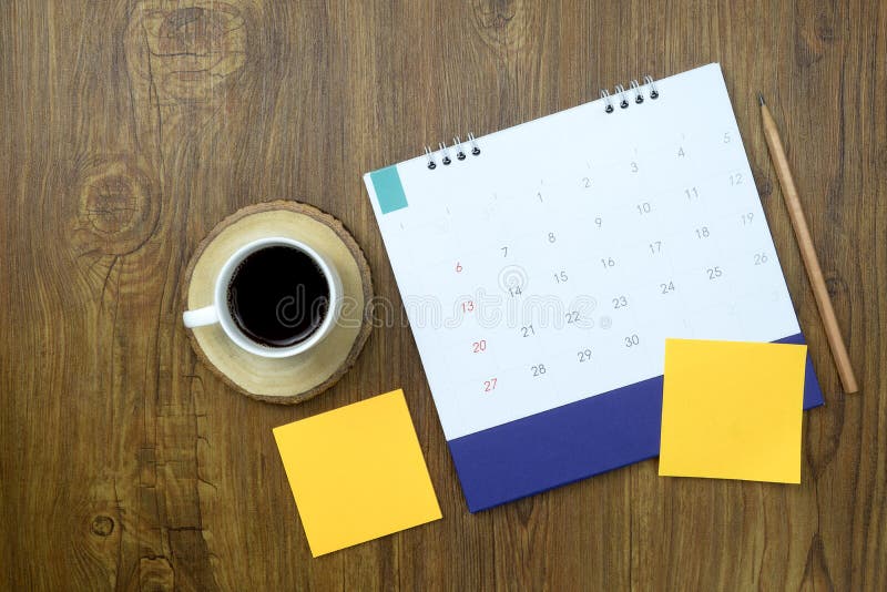 Calendar with Note Paper and Coffee on Wooden Texture Background. Plan ...