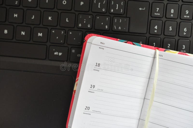 Calendar on a notebook stock photo. Image of font, electronics - 333356708