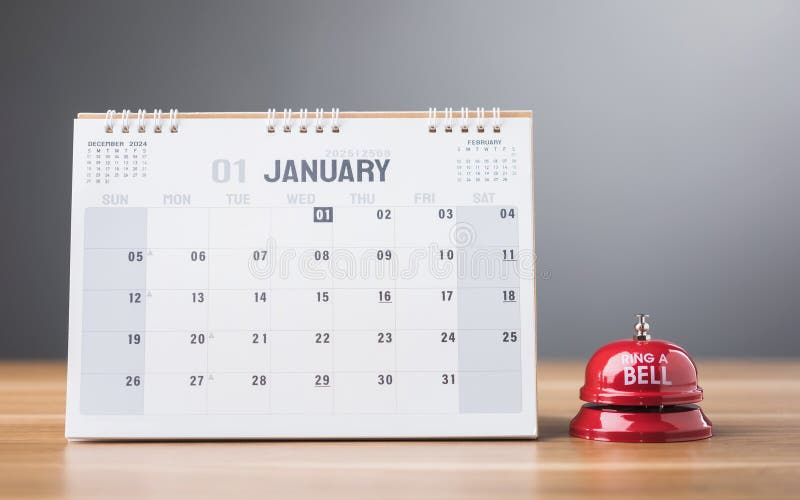 2025 Calendar Open To January with a Red Bell on the Table, Symbolizing ...
