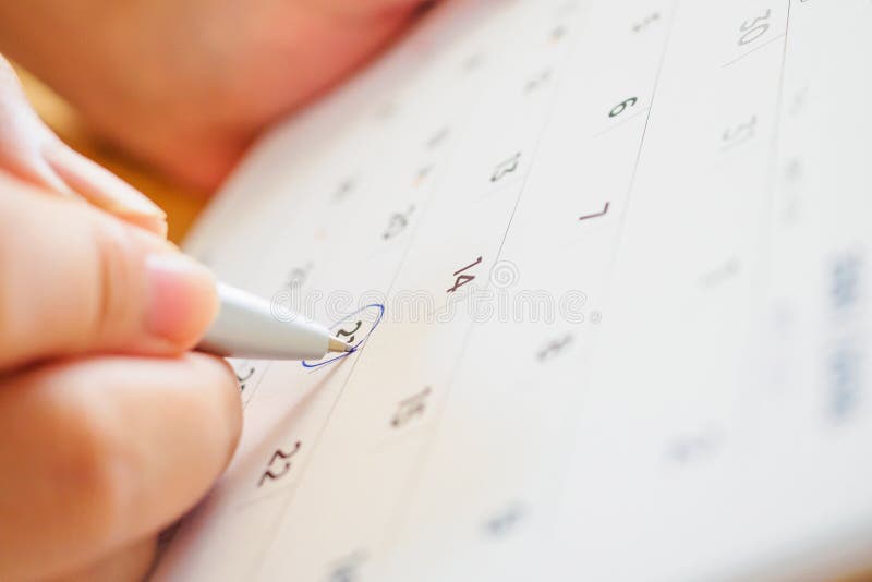 Calendar Page with Hand Holding Pen Stock Photo - Image of office ...