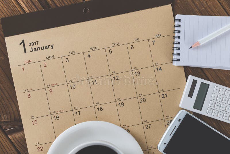 A Calendar Placed on the Table Stock Photo - Image of coffee, method ...