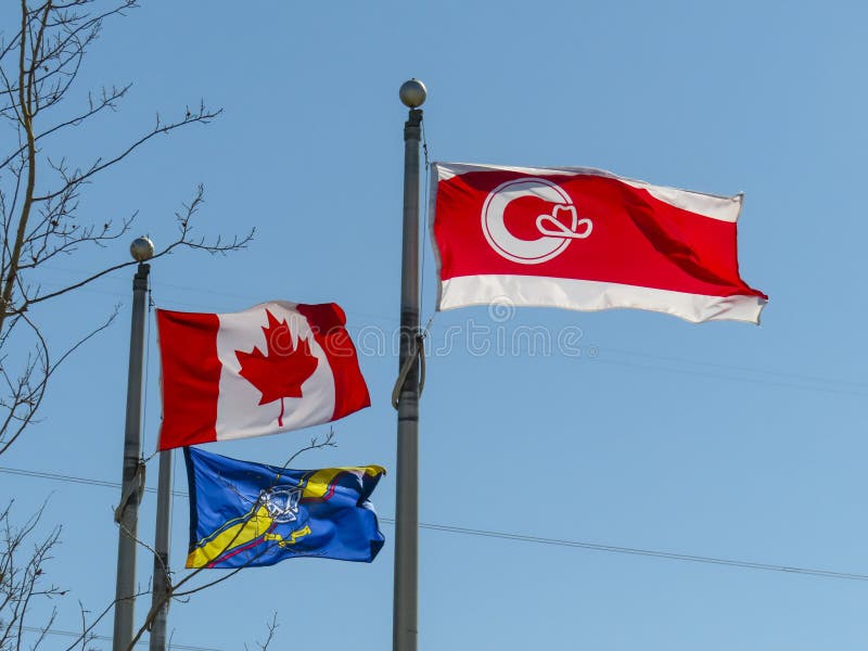 A Calgary Flag Next To a Canada Flag with a Calgary Fire Department ...