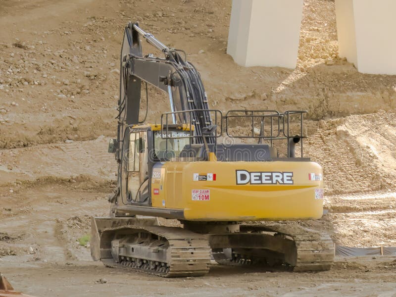 Back Site of an Industrial Deere Heavy Excavator for Digging on a ...