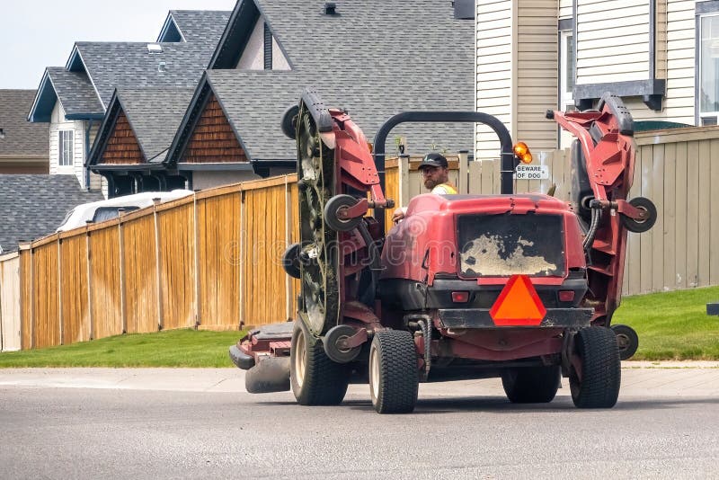 A Person Driving a Big Mower on the Route during Spring Editorial Stock ...