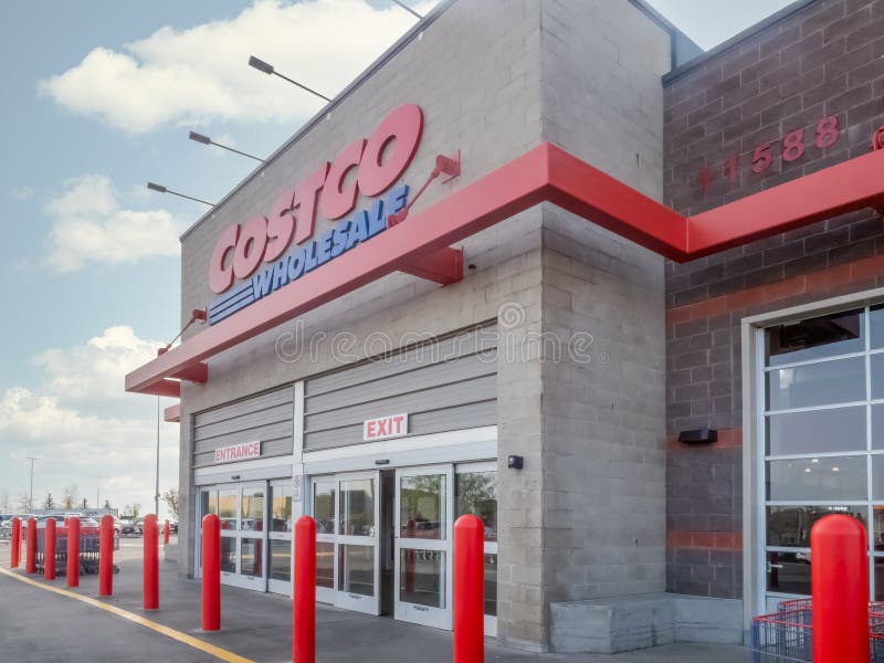 A Costco Wholesale Store Front is Captured Under a Cloudy Sky ...