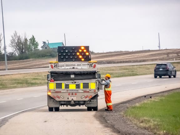 A Roadside Worker on the Highway Editorial Image - Image of automobile ...