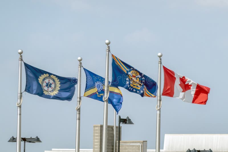 Several Emergency Services Flags with the Canadian Flag Editorial ...