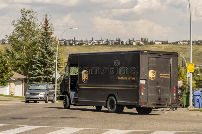 An UPS Delivery Truck on the Route during Fall Editorial Photography ...