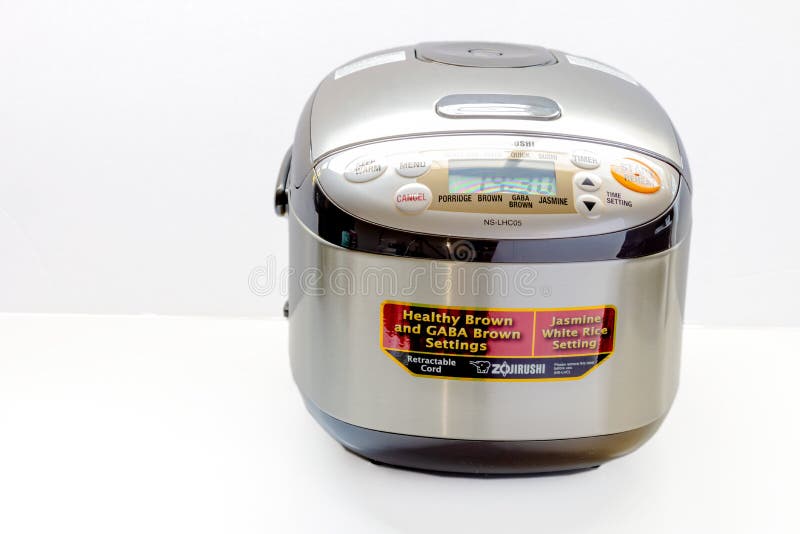 A Zojirushi 5.5 Cup Microcomputer Rice Cooker and Warmer on White ...